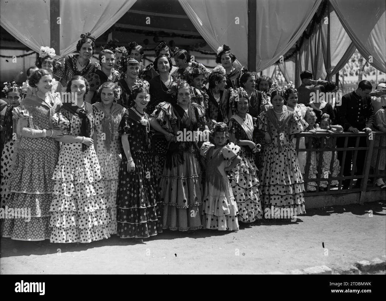 Seville. April 1936. Women dressed in gypsy costumes posing at the door ...