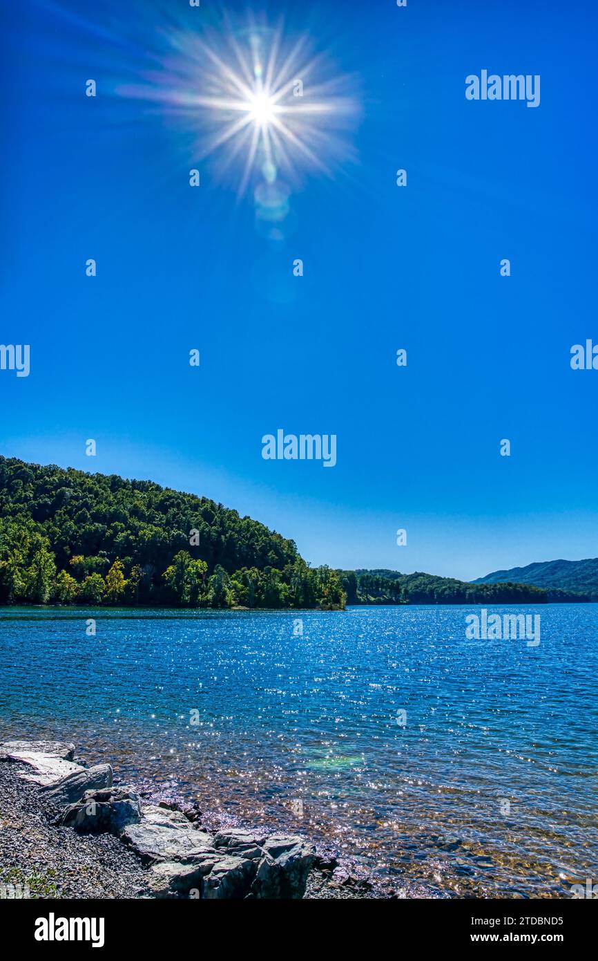Sun forms sunstar over Lake Watuga at the Watuga Point Recreation Area ...