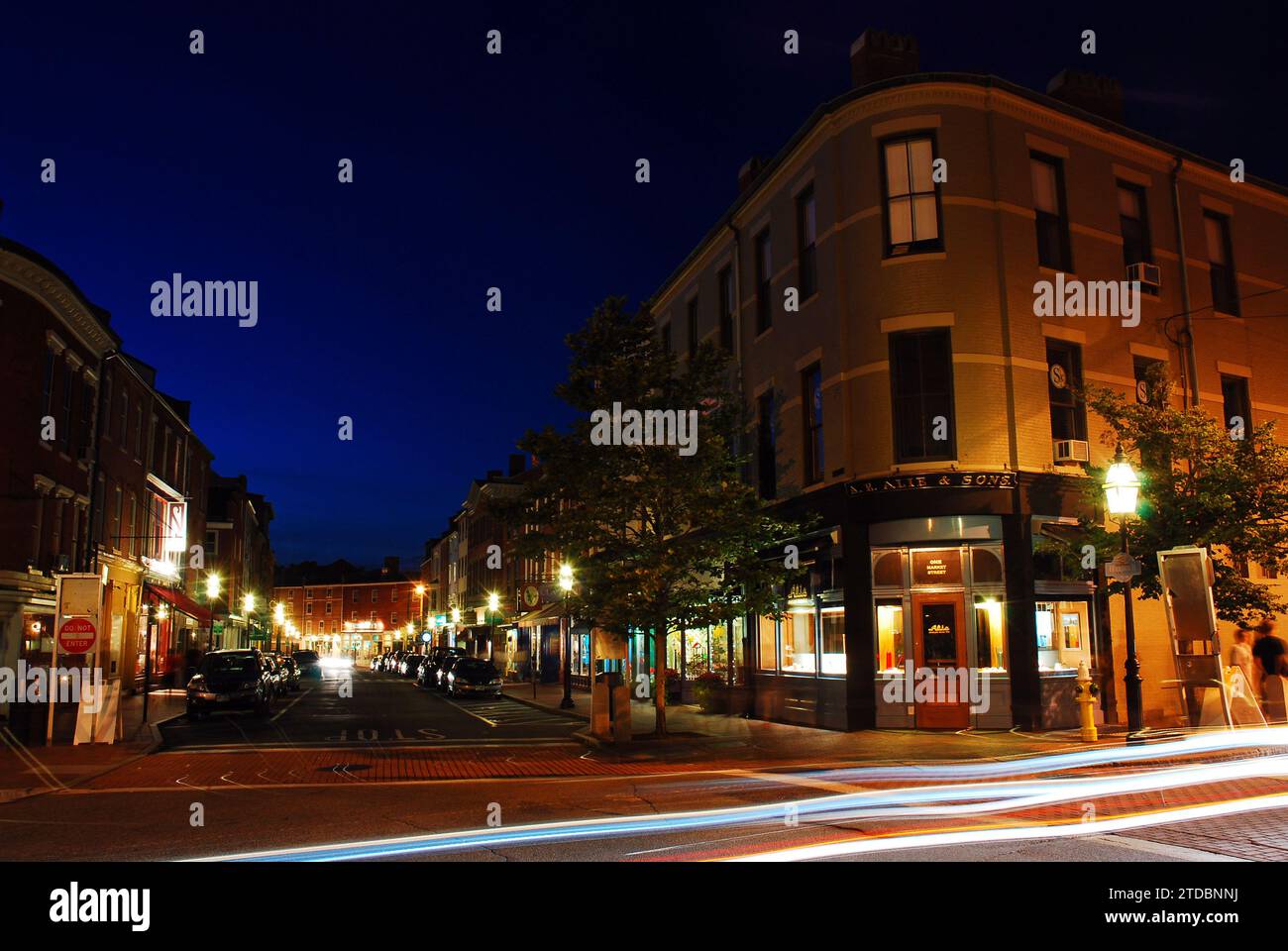 Traffic streaks through downtown Portsmouth, New Hampshire at dusk ...