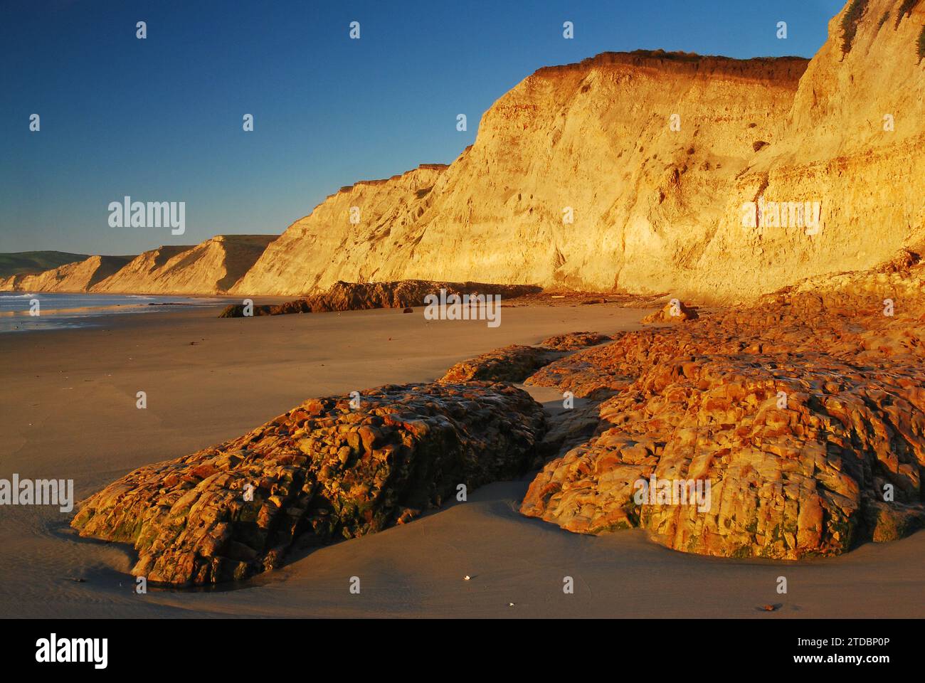 Rock formations sit at the bottom of the cliff near Drakes Bay, Point ...