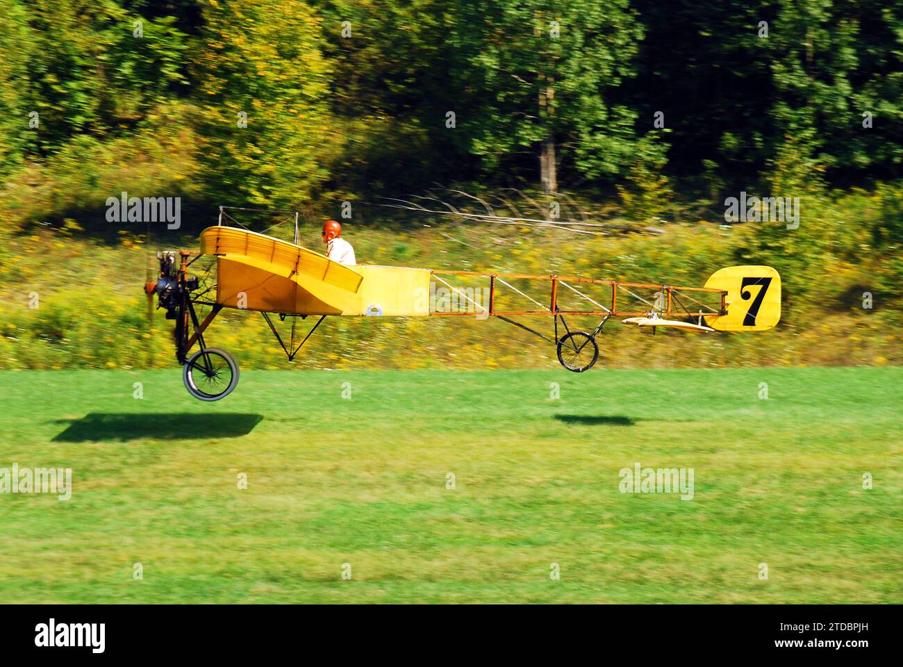 A daring pilot takes off in the open cockpit of a Bleroit XI airplane ...