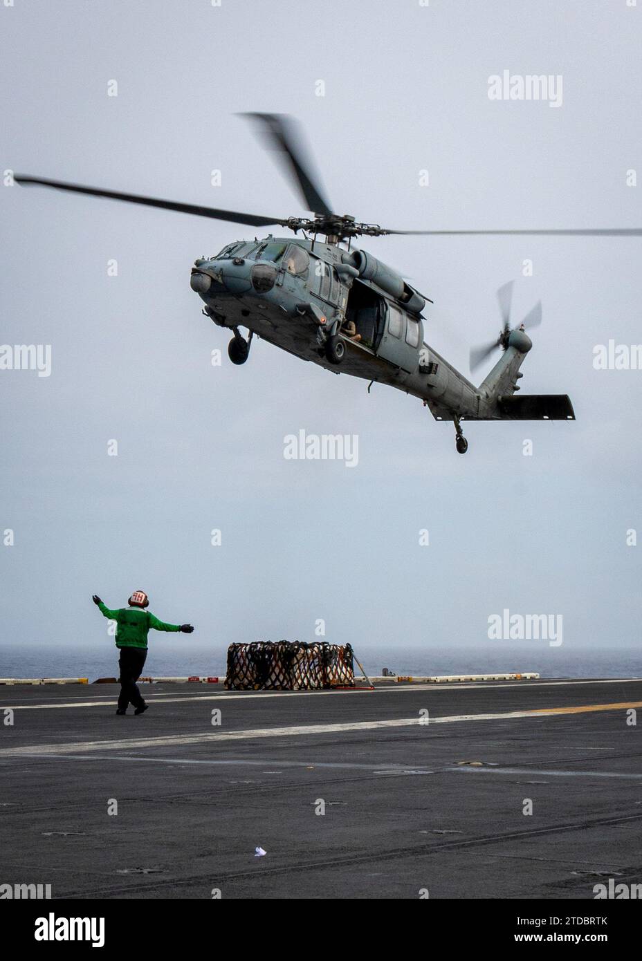 231215-N-TD381-1305 SOUTH CHINA SEA (Dec. 15, 2023) An MH-60S Sea Hawk ...