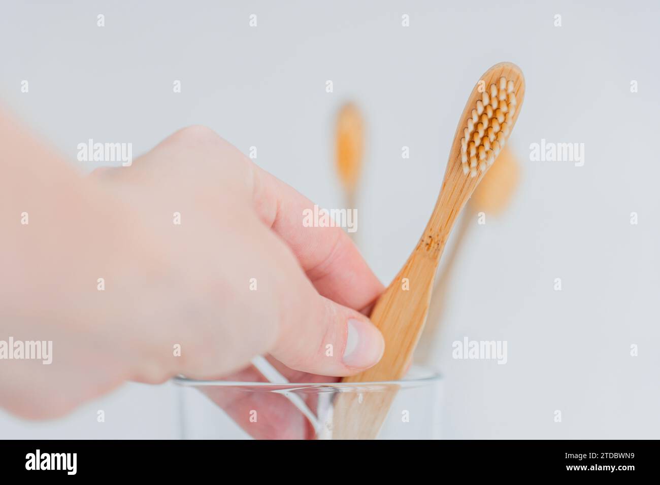 toothbrush.Teeth cleaning.Toothbrush in hand under tap water in ...