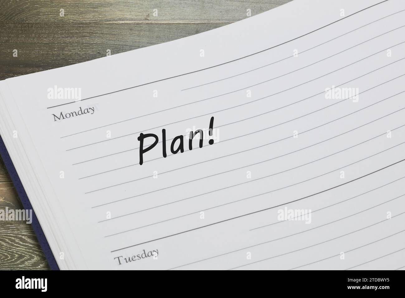 Plan reminder message in an open diary Stock Photo - Alamy