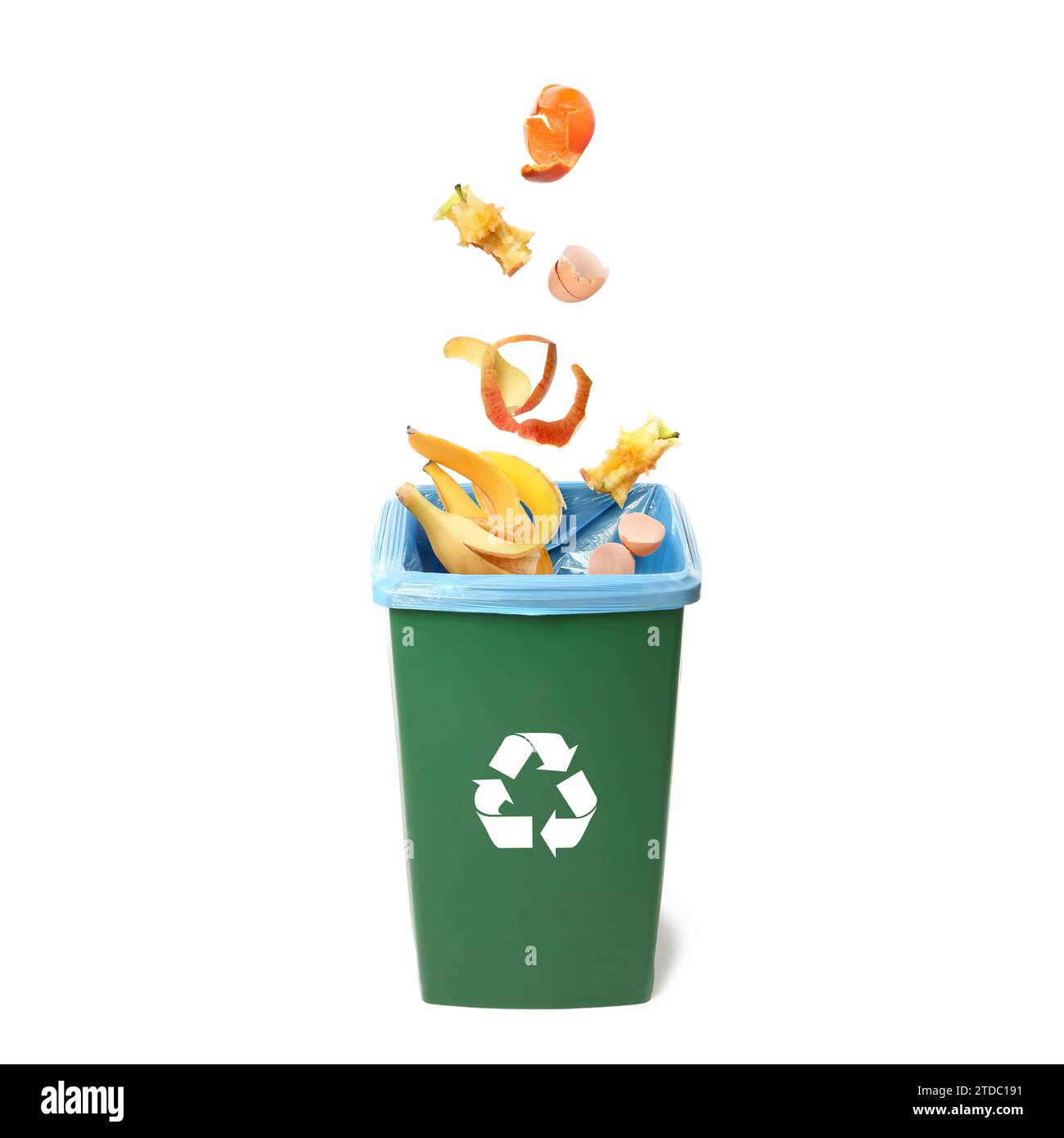 Garbage falling into trash bin on white background Stock Photo - Alamy