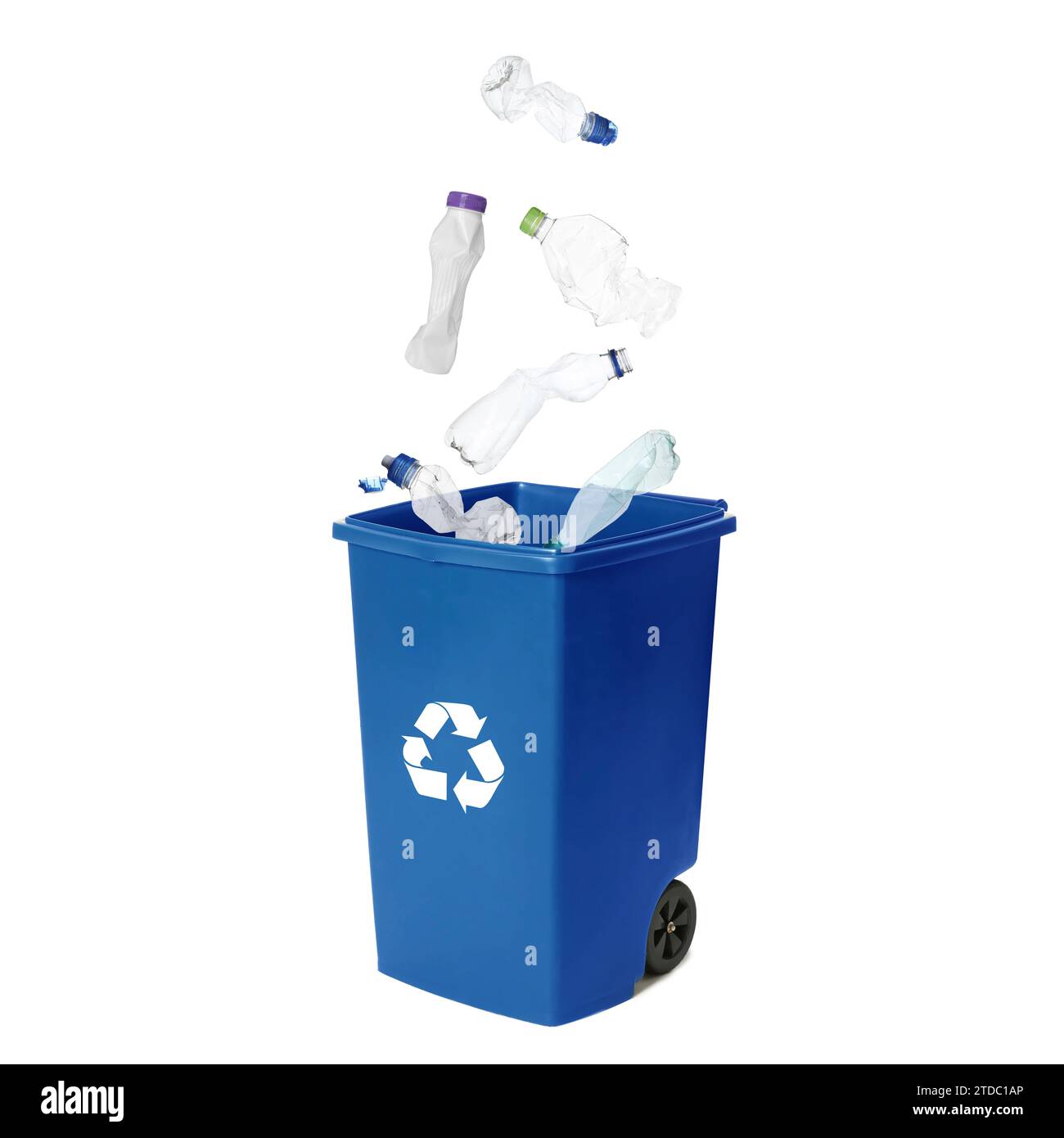 Garbage falling into trash bin on white background Stock Photo - Alamy