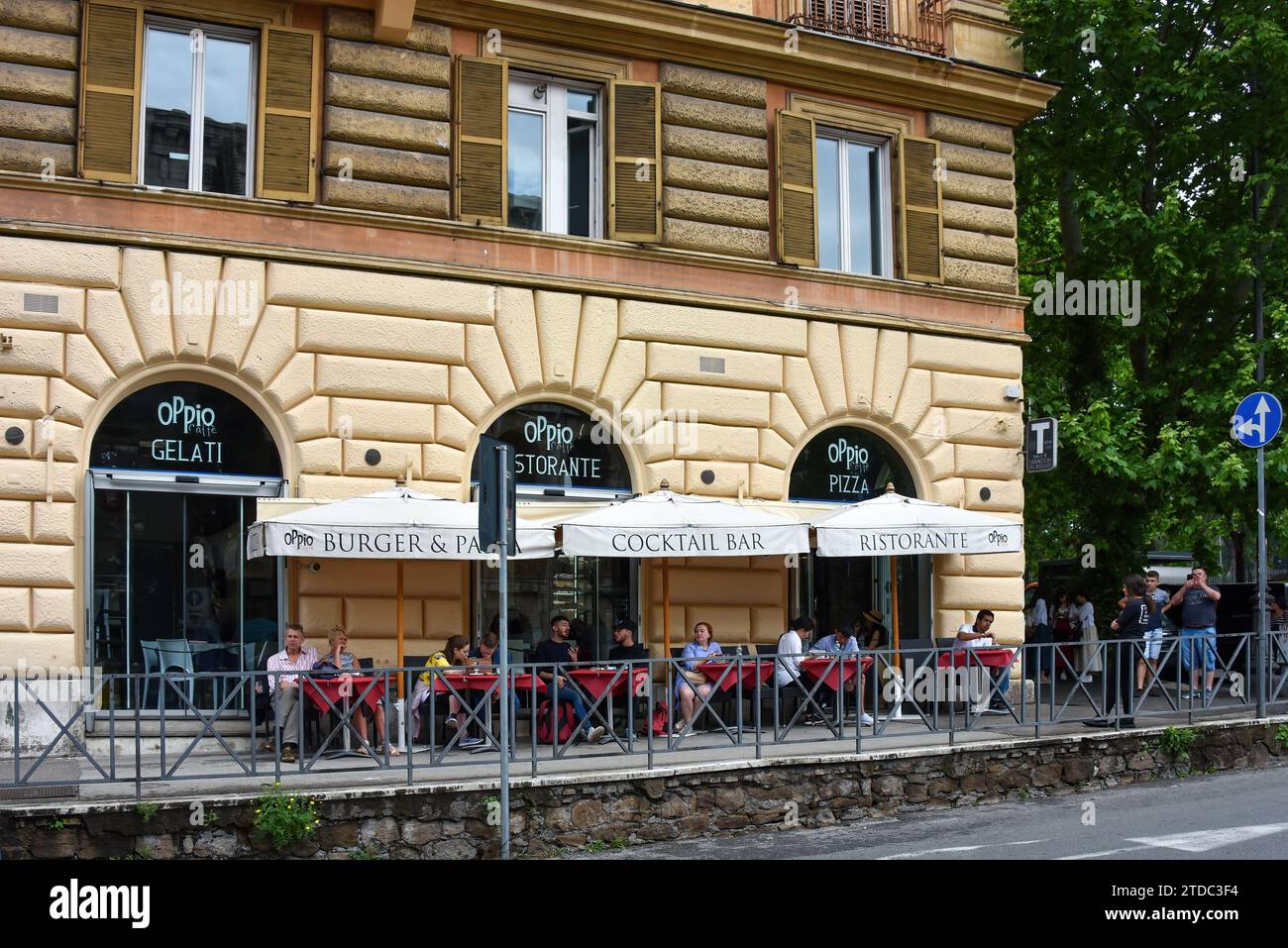 Rome, Italy - May 9, 2018: people eat at Oppio cafe restaurant with outdoor tables across from ...