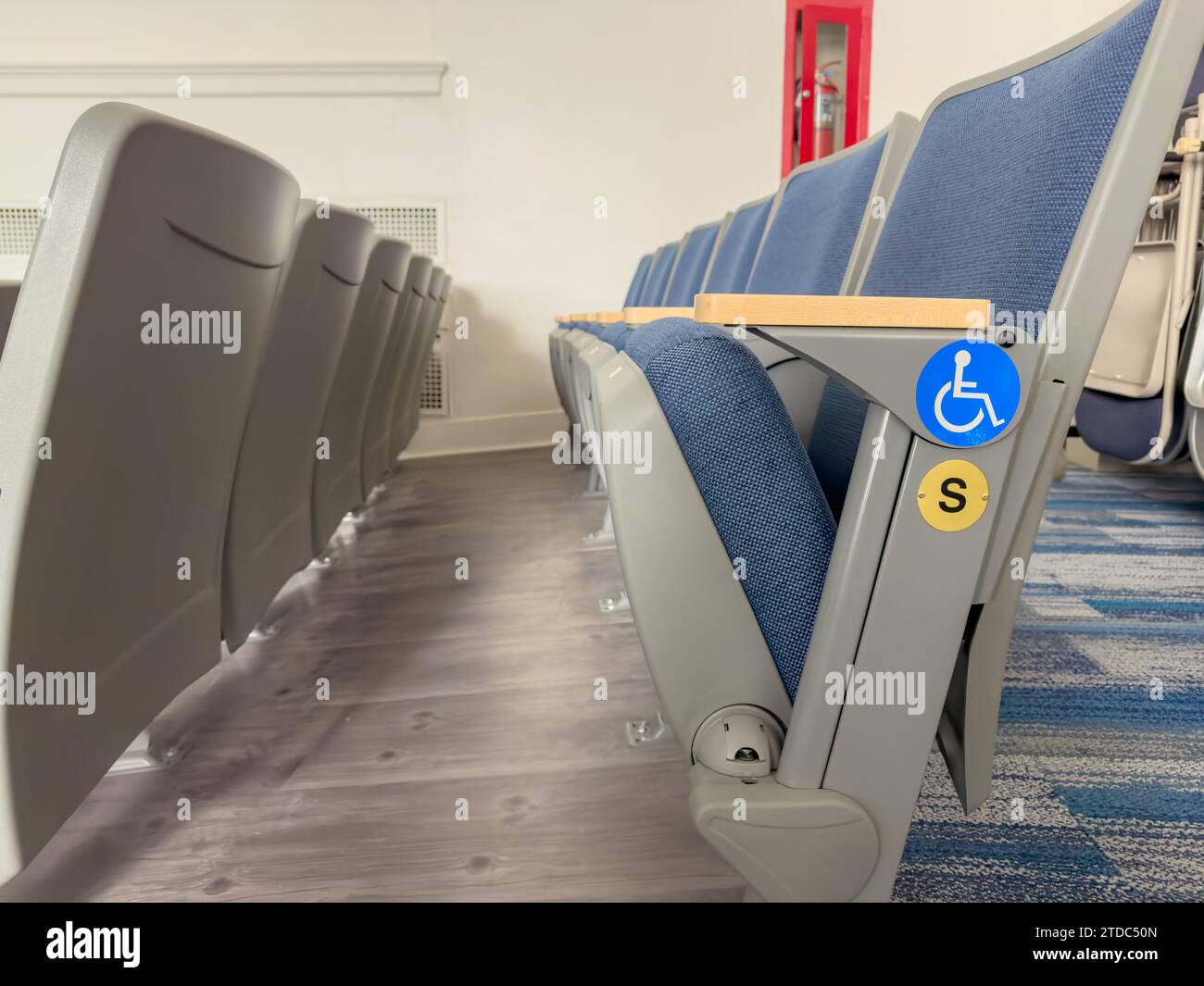 Close up image of empty ADA, accessible, gray and blue theater ...