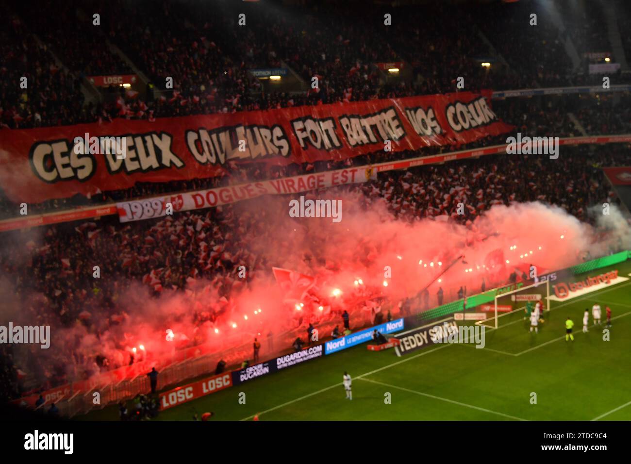 Lille, France, 17th December 2023. Lille vs PSG. The Lille Ultras light ...