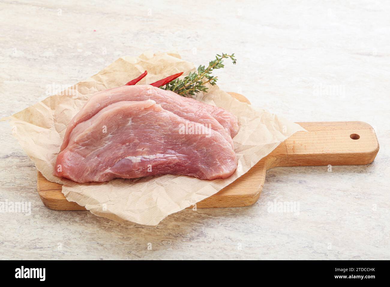 Raw pork schnitzel cut for roast Stock Photo - Alamy