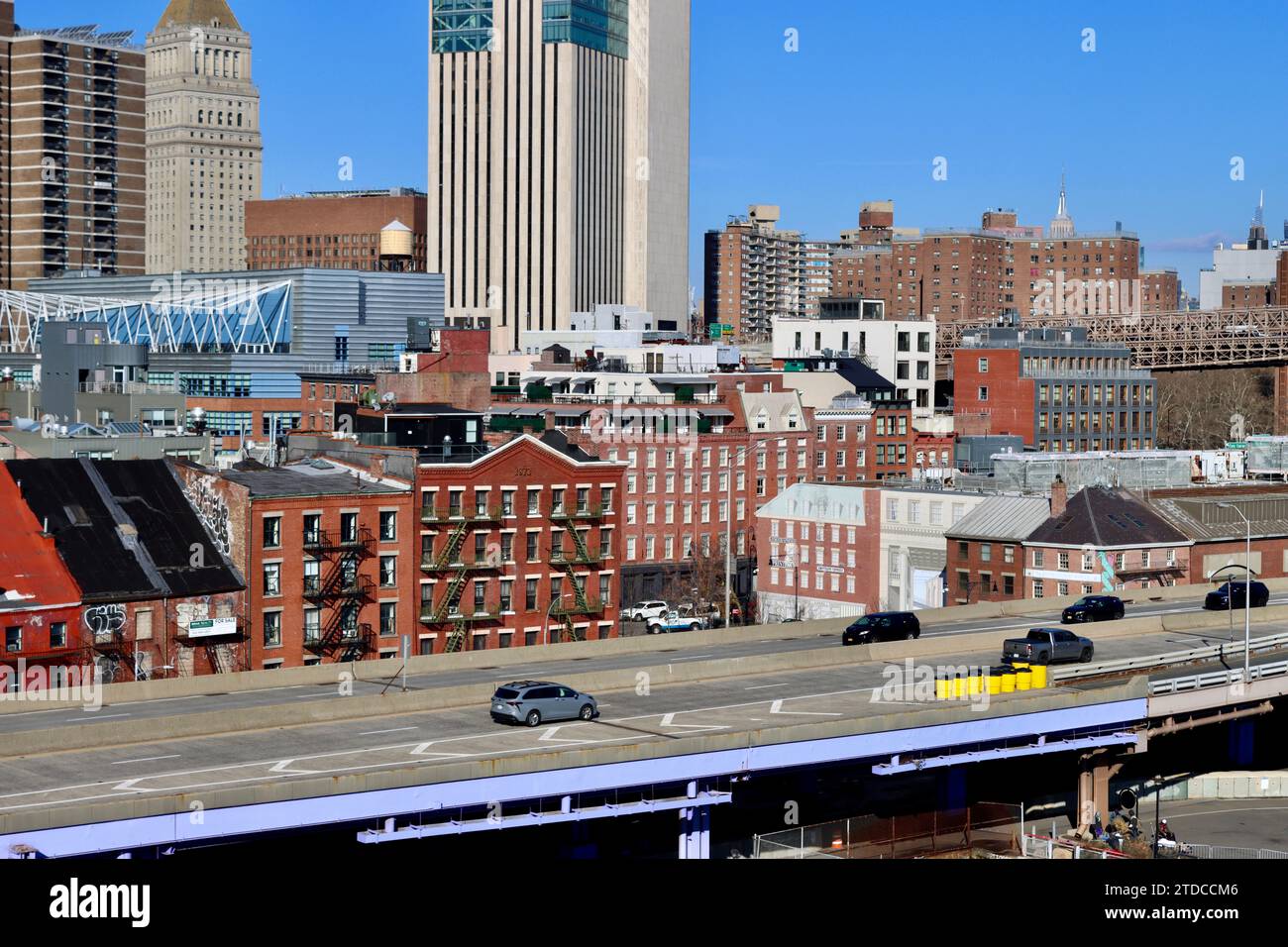 Elevated FDR drive passing old buildings of South Street Seaport area ...