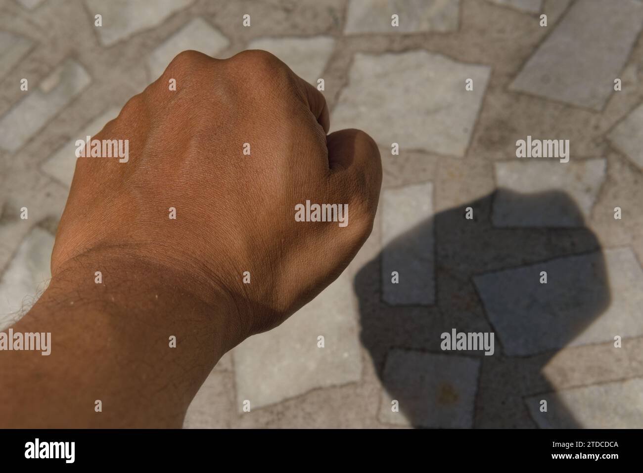picture of human fist along with its shadow Stock Photo - Alamy