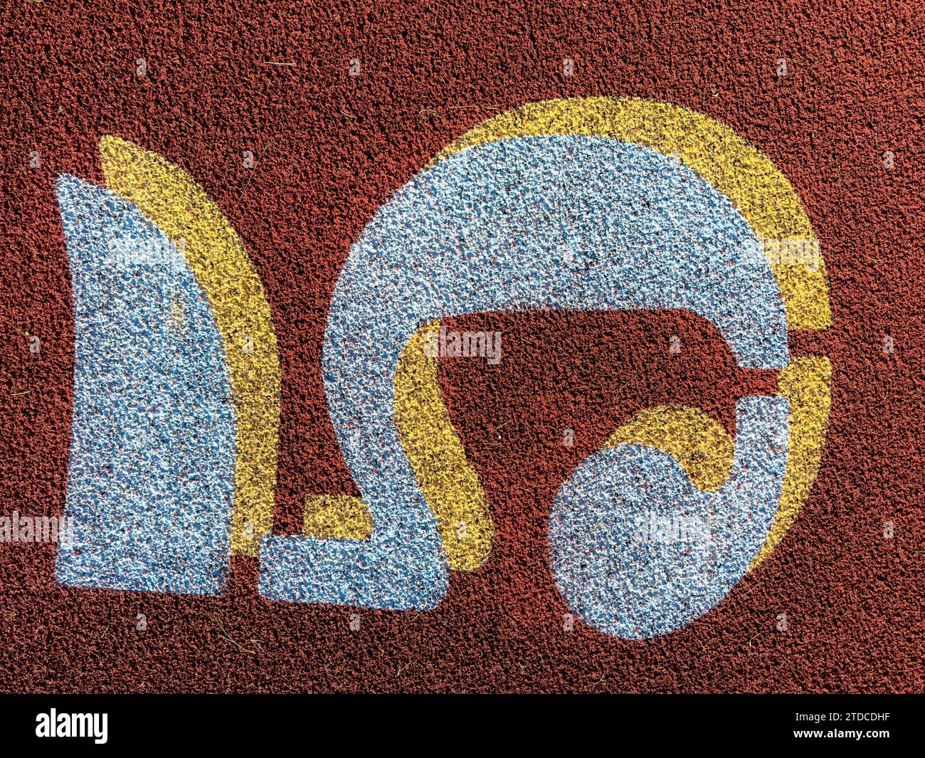 Close up lane number 5 on a new red running track with white lane lines ...