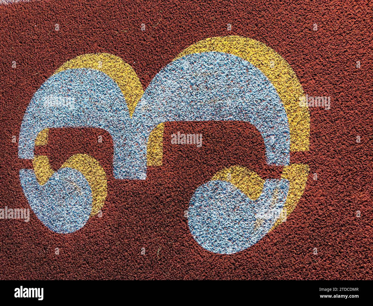 Close up lane number 3 on a new red running track with white lane lines ...