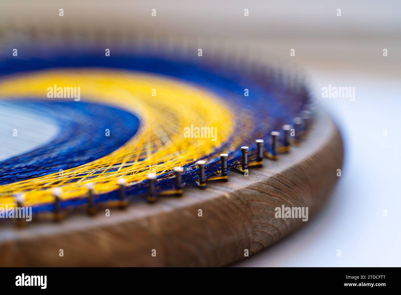 Colored thread mandala on a wooden board with nails. Mandala Moon ...