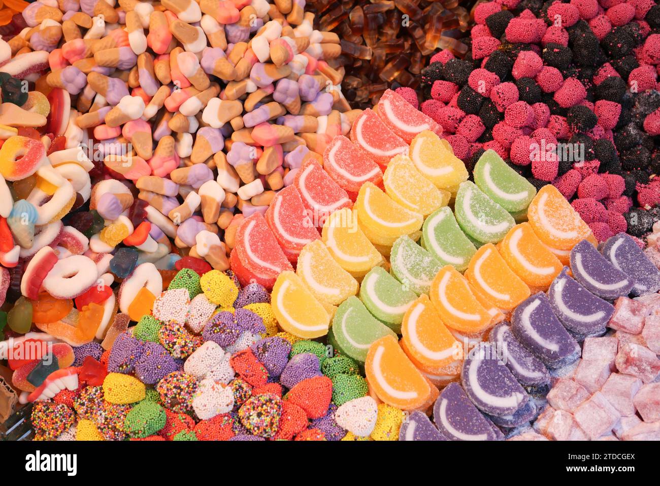 display of a bunch of colorful chewy jellies with various shape and ...