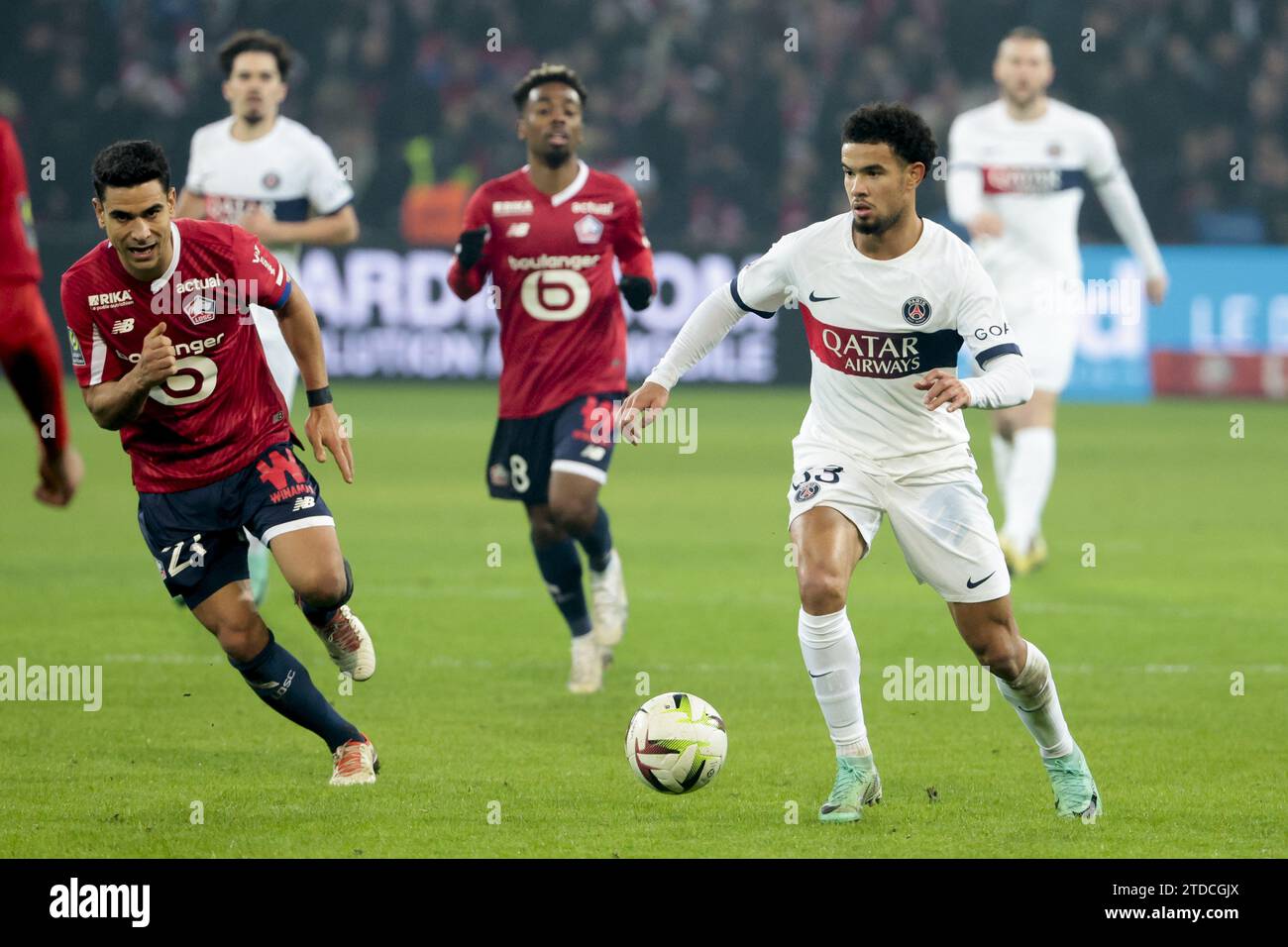 Warren Zaire-Emery of PSG, left Benjamin Andre of Lille during the ...