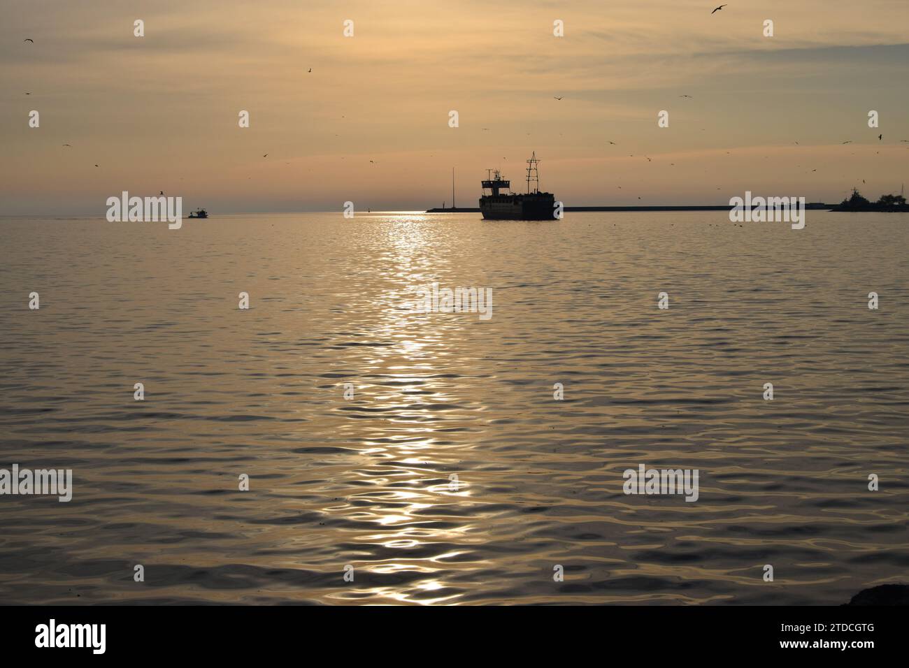 Island sea view ships with sun and nature sunset hi-res stock ...
