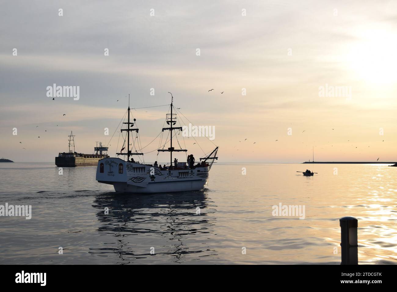 Island sea view ships with sun and nature sunset hi-res stock ...