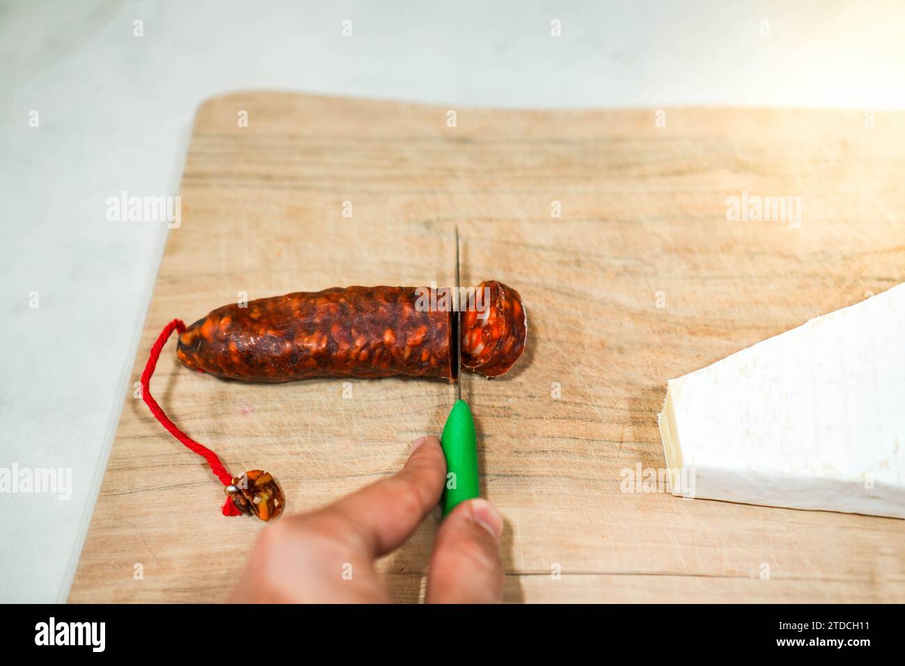 Chorizo sausage being cut hi-res stock photography and images - Alamy