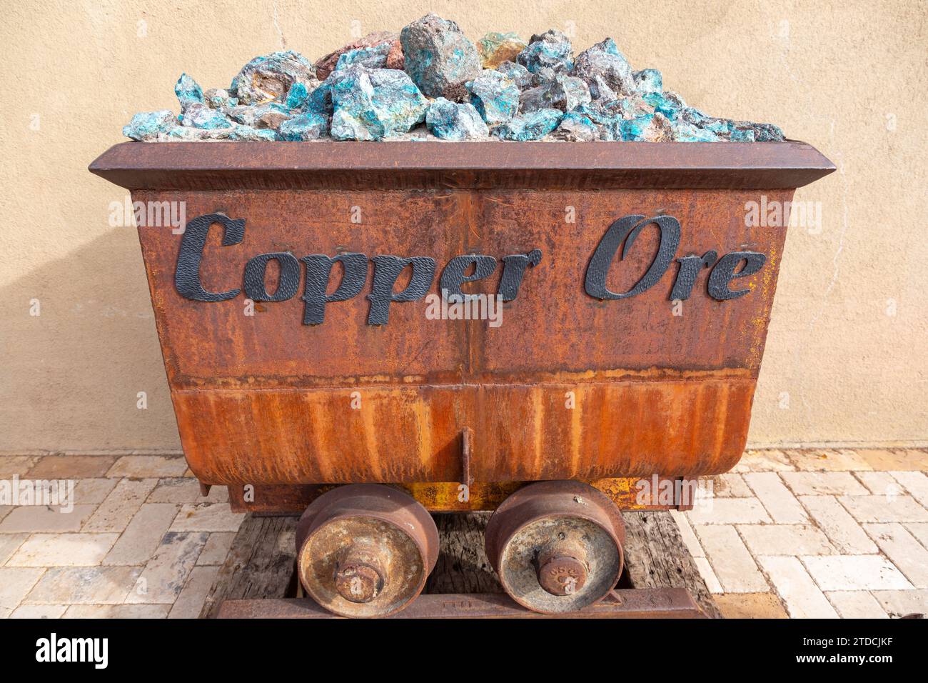 Old Vintage Rusted Cart Wagon Model Filled with Ore in Front of Copper ...