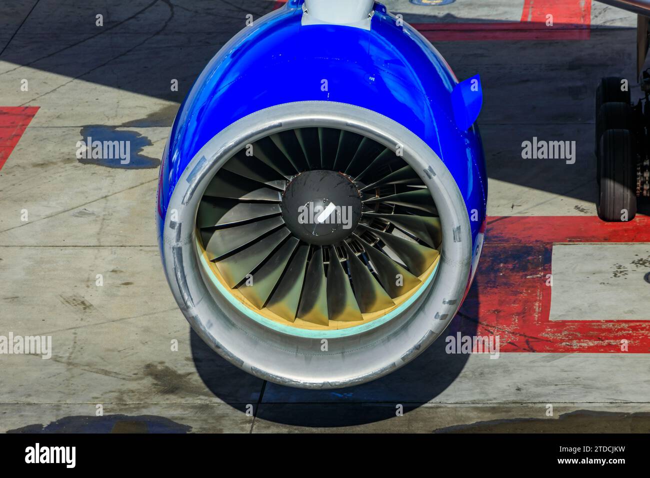 Close up of an airplane engine of a passenger aircraft parked at a gate ...