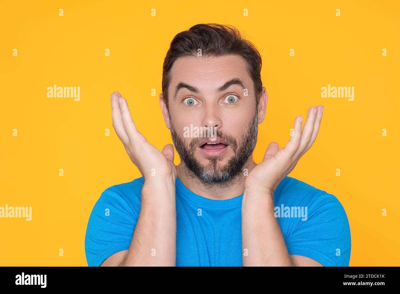 Handsome surprised man over isolated studio background afraid and ...