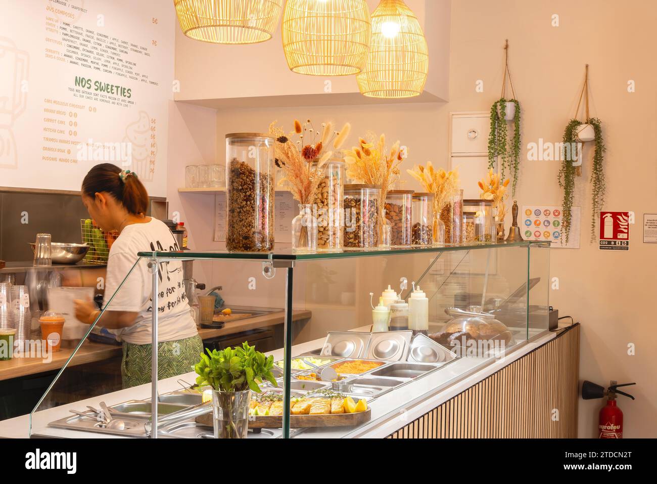 Woman behind bar counter hi-res stock photography and images - Alamy