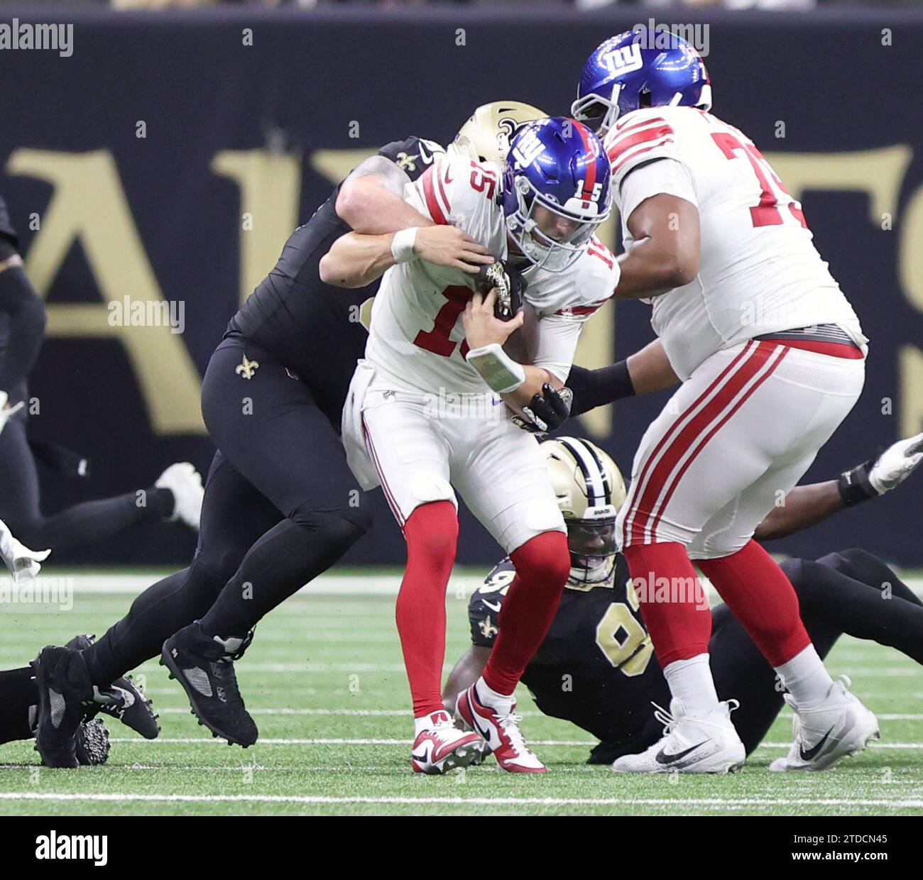 New Orleans Saints defensive tackle Bryan Bresee (90) sacks New York Giants quarterback Tommy ...