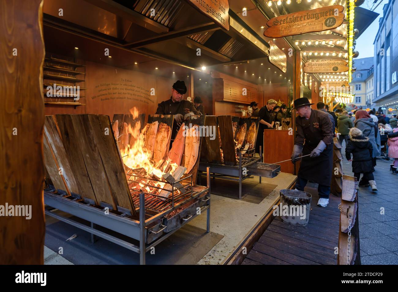Bonn, Germany - December 16, 2023 : View of flamed salmon over beech ...
