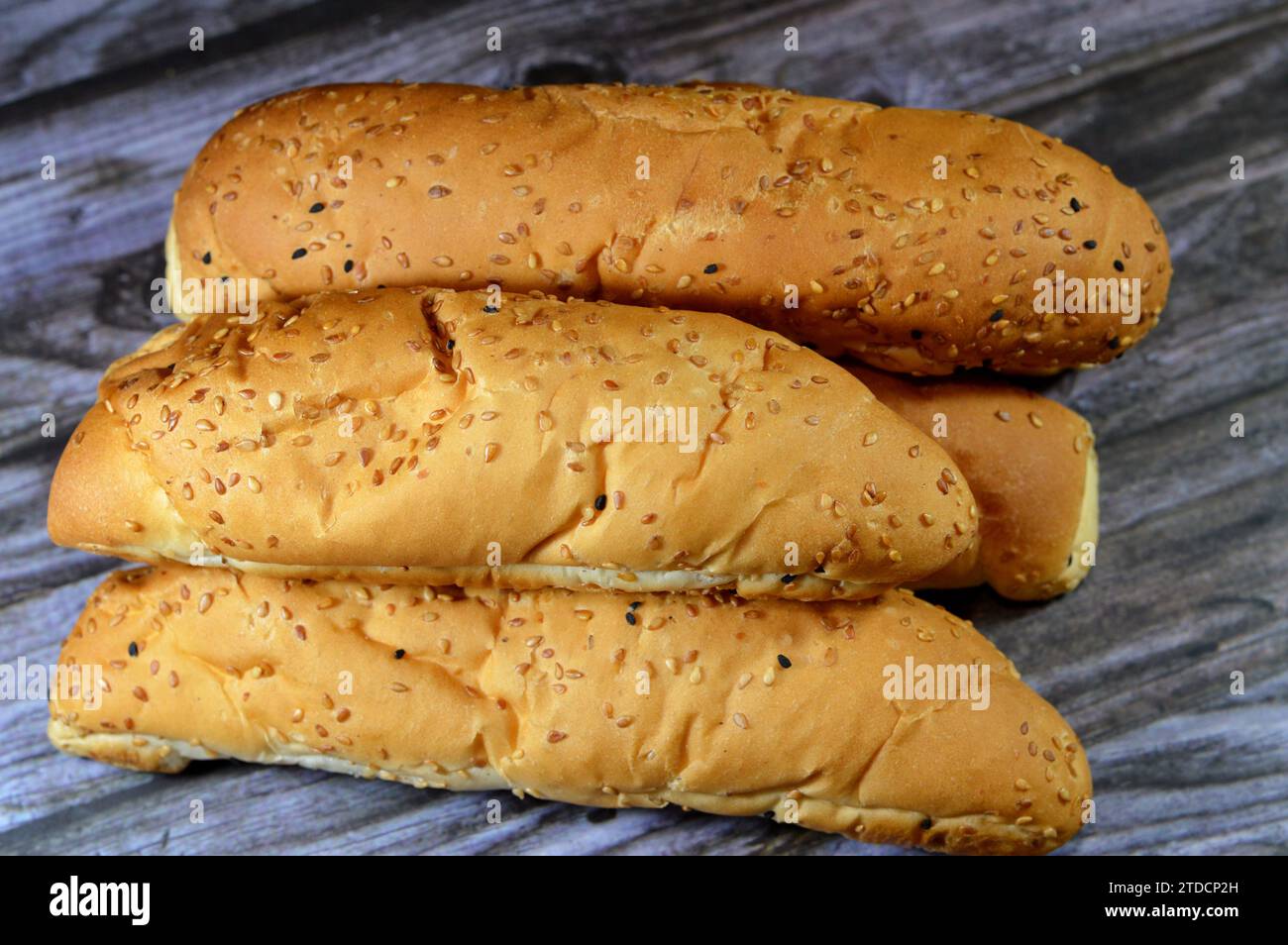Long sesame and black Baraka seed bun bread, fresh baked loaf of bread ...