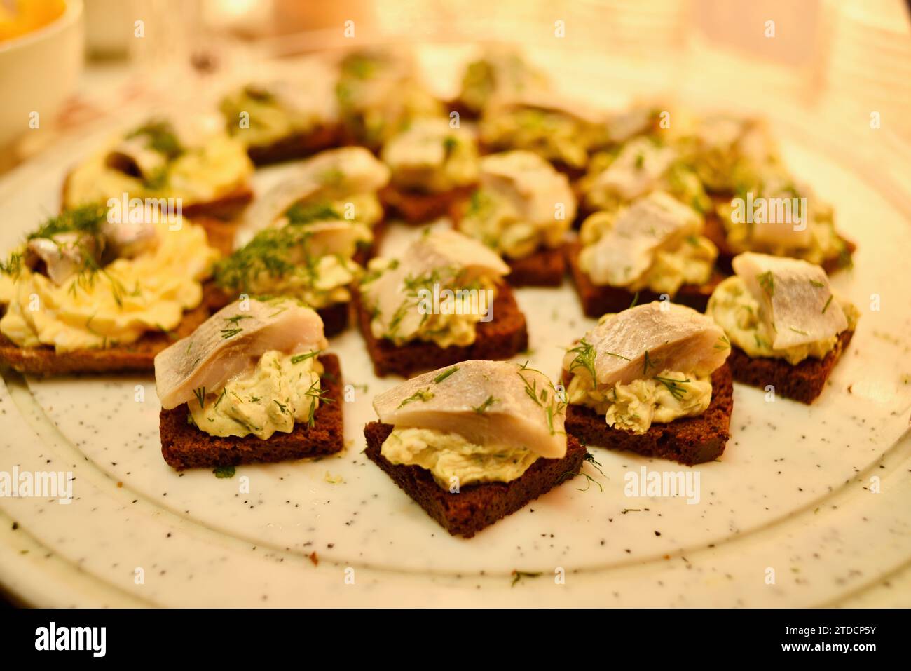 Traditional cured herring on Estonian rye bread as finger food ...