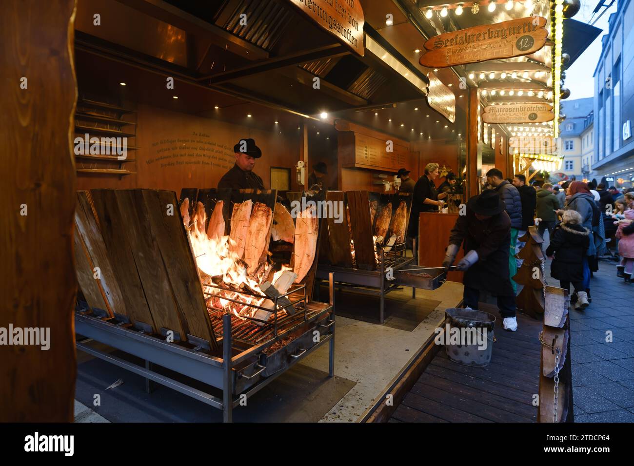 Bonn, Germany - December 16, 2023 : View of flamed salmon over beech ...