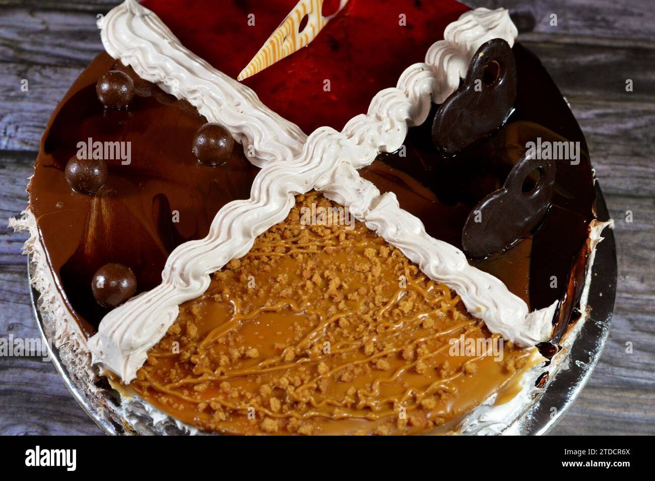A birthday cake, four different quarters spongy creamy cake for ...