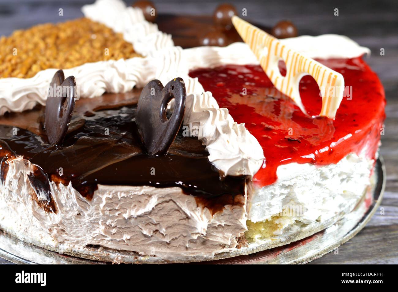 A birthday cake, four different quarters spongy creamy cake for ...