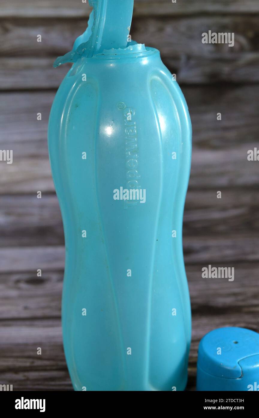 Cairo, Egypt, December 16 2023: broken fragments of a Tupperware bottle ...