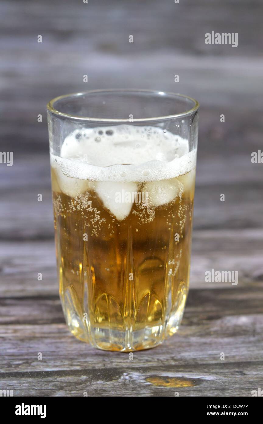 Apple malt drink in a glass with ice cubes, natural and refreshing ...