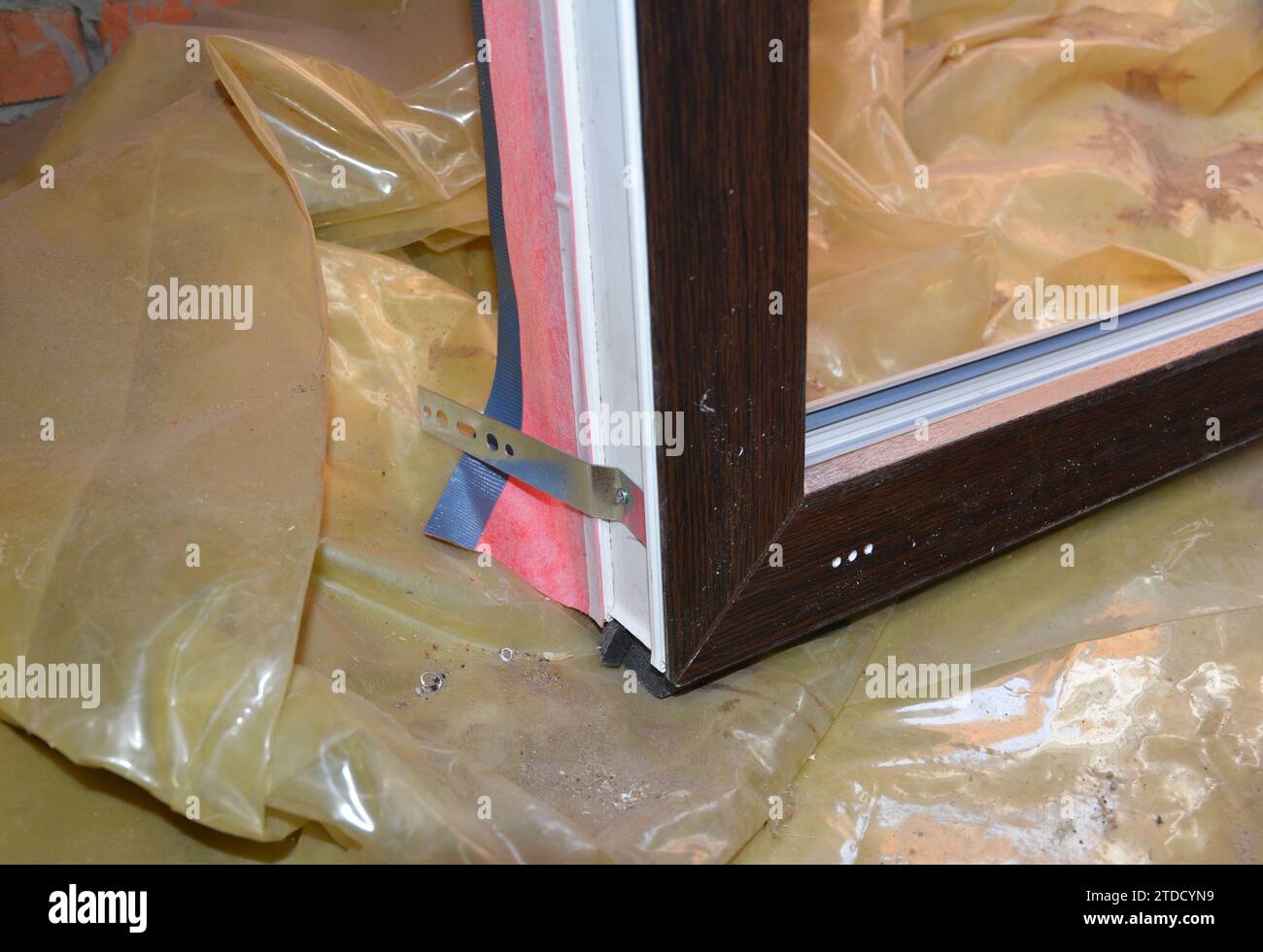 Window tape inside with window frame holder before installation. Vapor barrier tape to cover ...