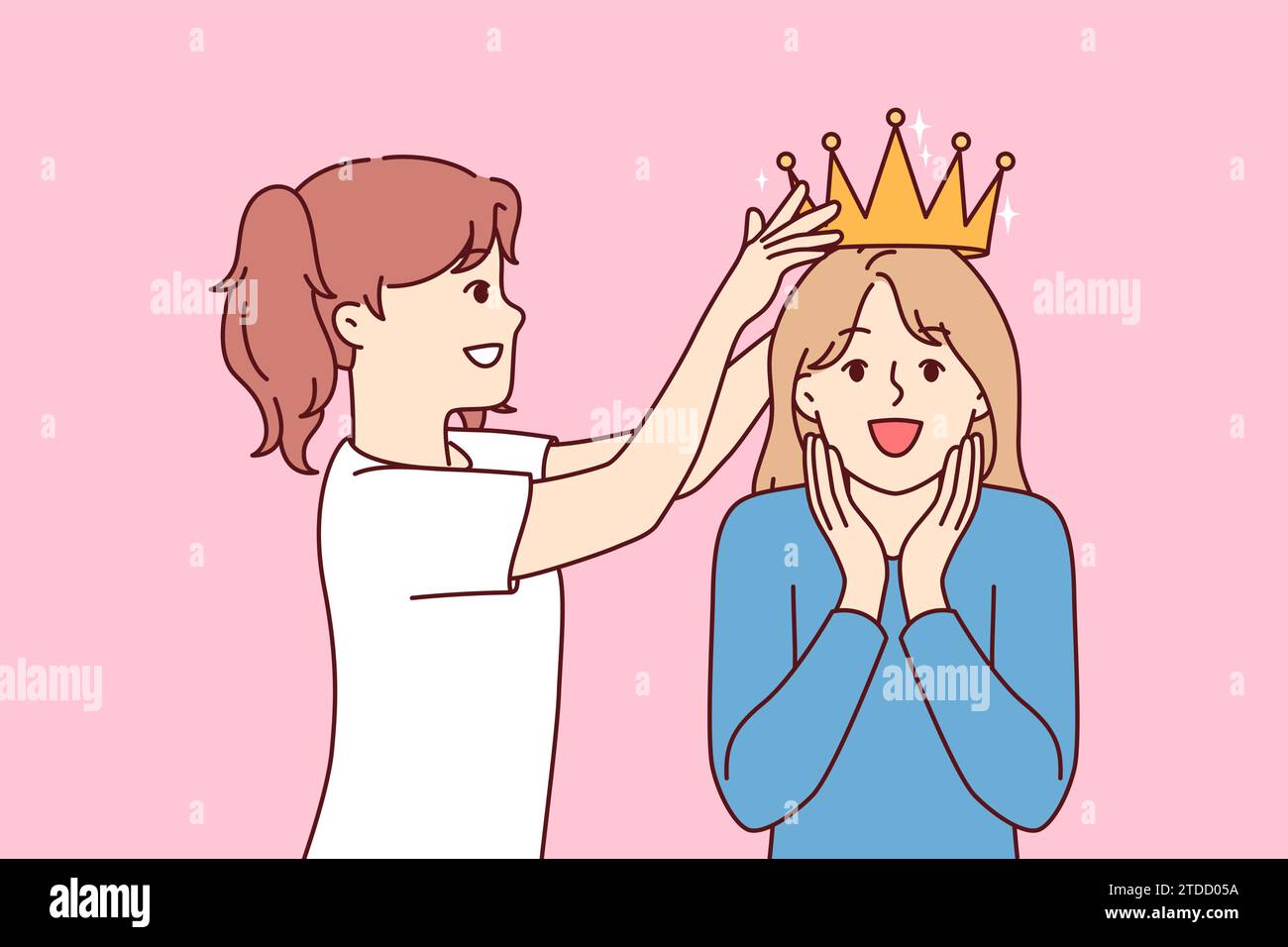 Little girl places crown on overjoyed sisters head while playing ...