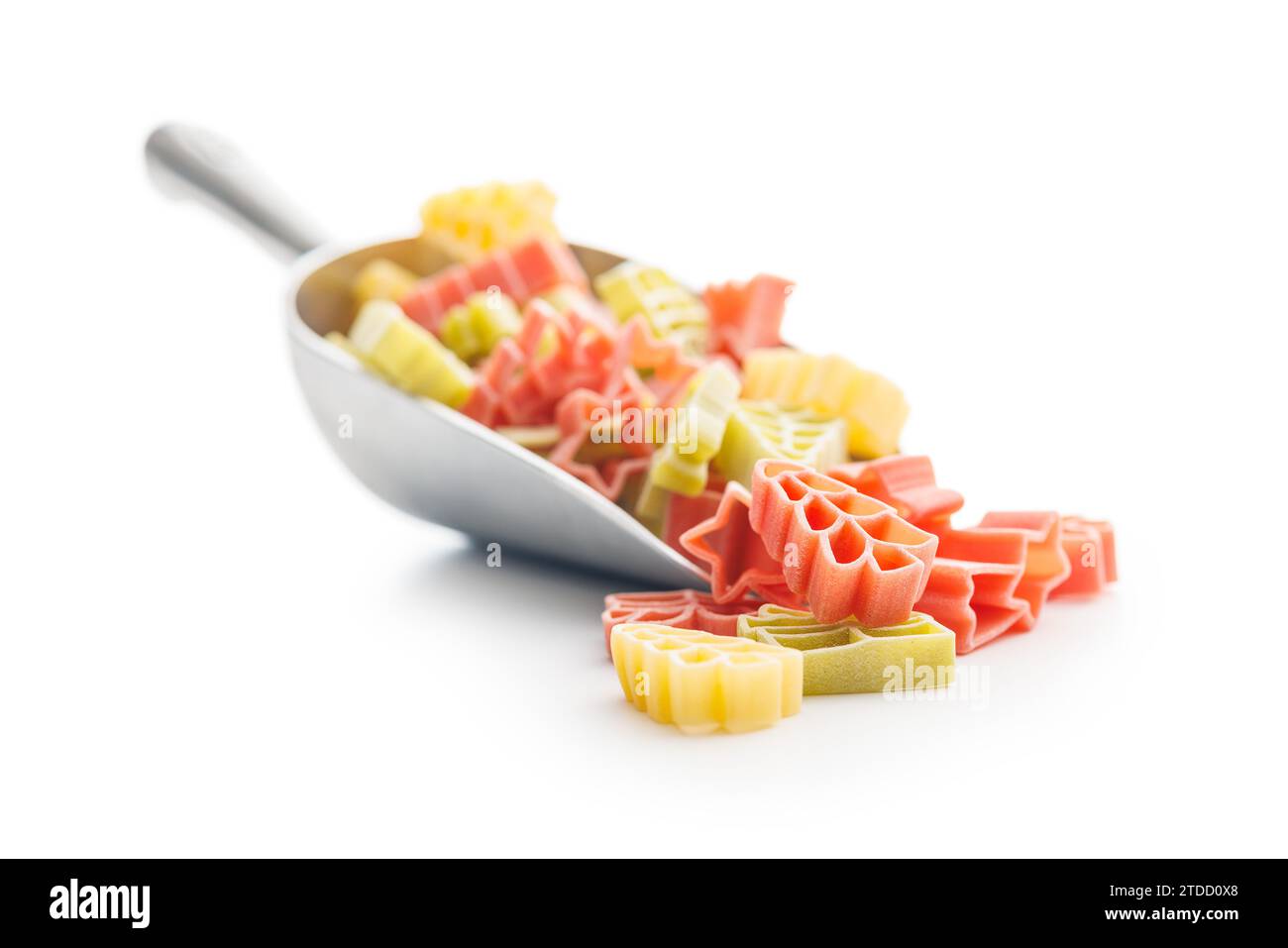 Uncooked raw pasta. Various Christmas shapes. Pasta in scoop isolated ...