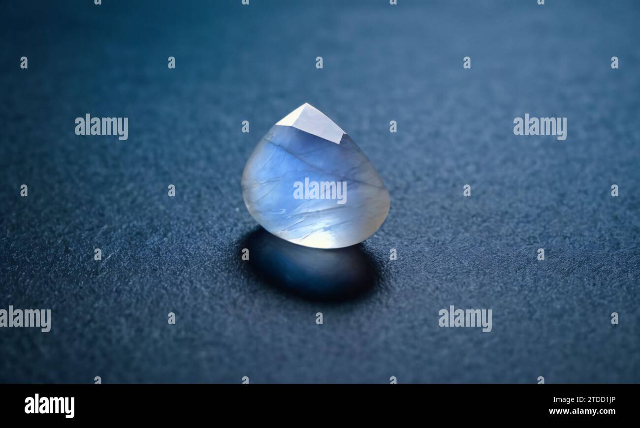 Natural precious moonstone on a dark gray background. Natural stone ...