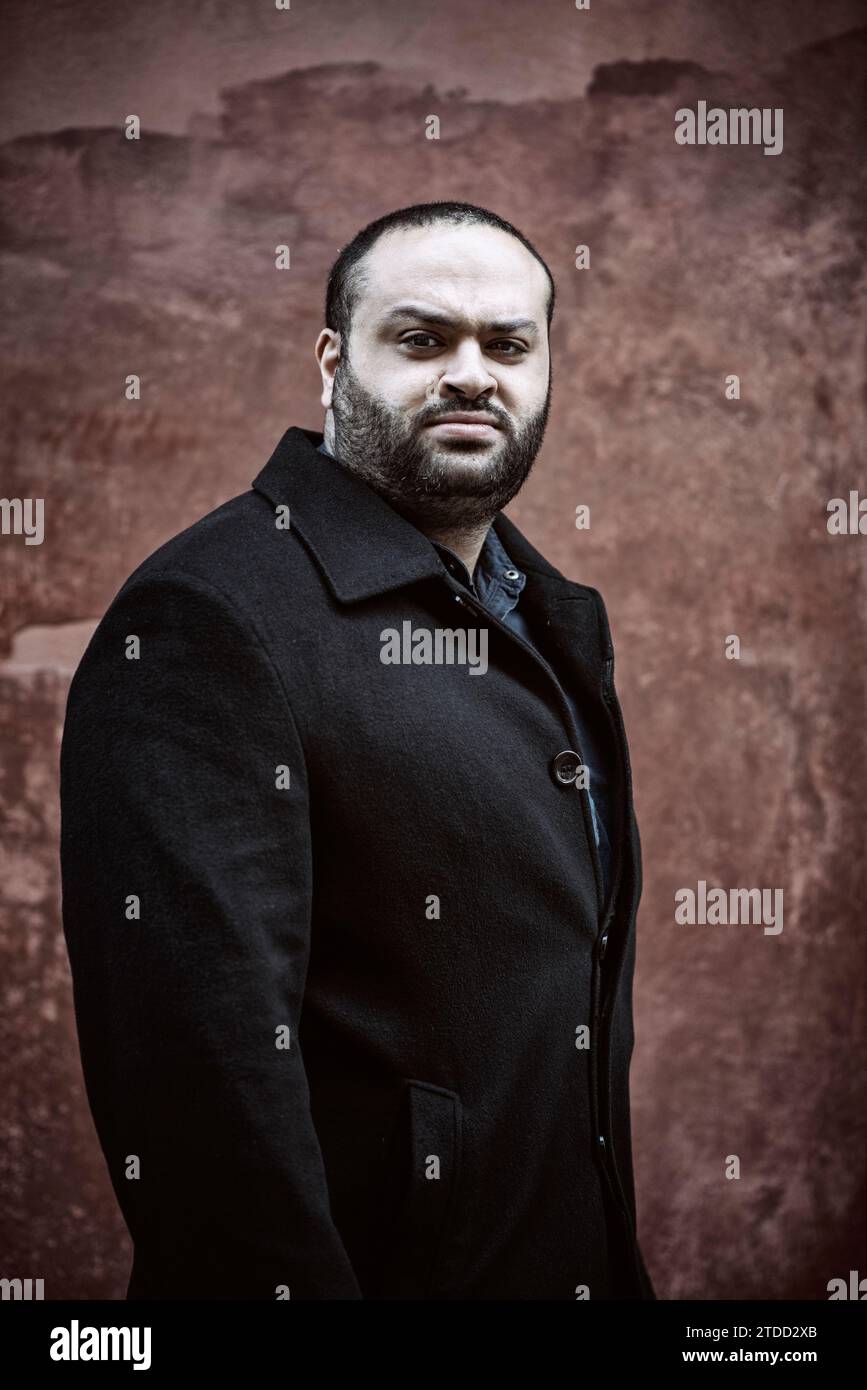 Big guy looking at cmaera outdoors Stock Photo - Alamy