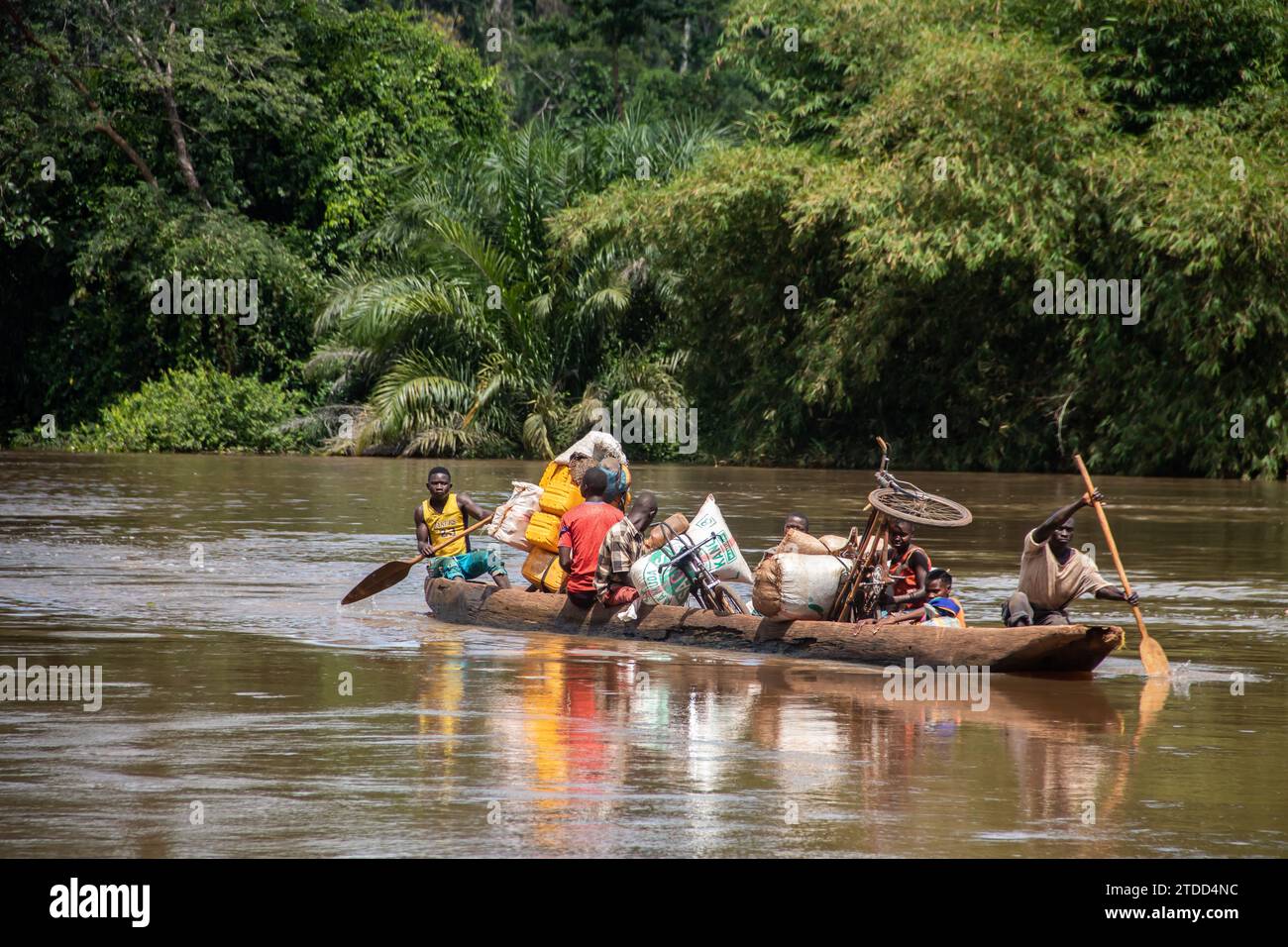 Transport of people across the Mbari river by locally made canoes and ...