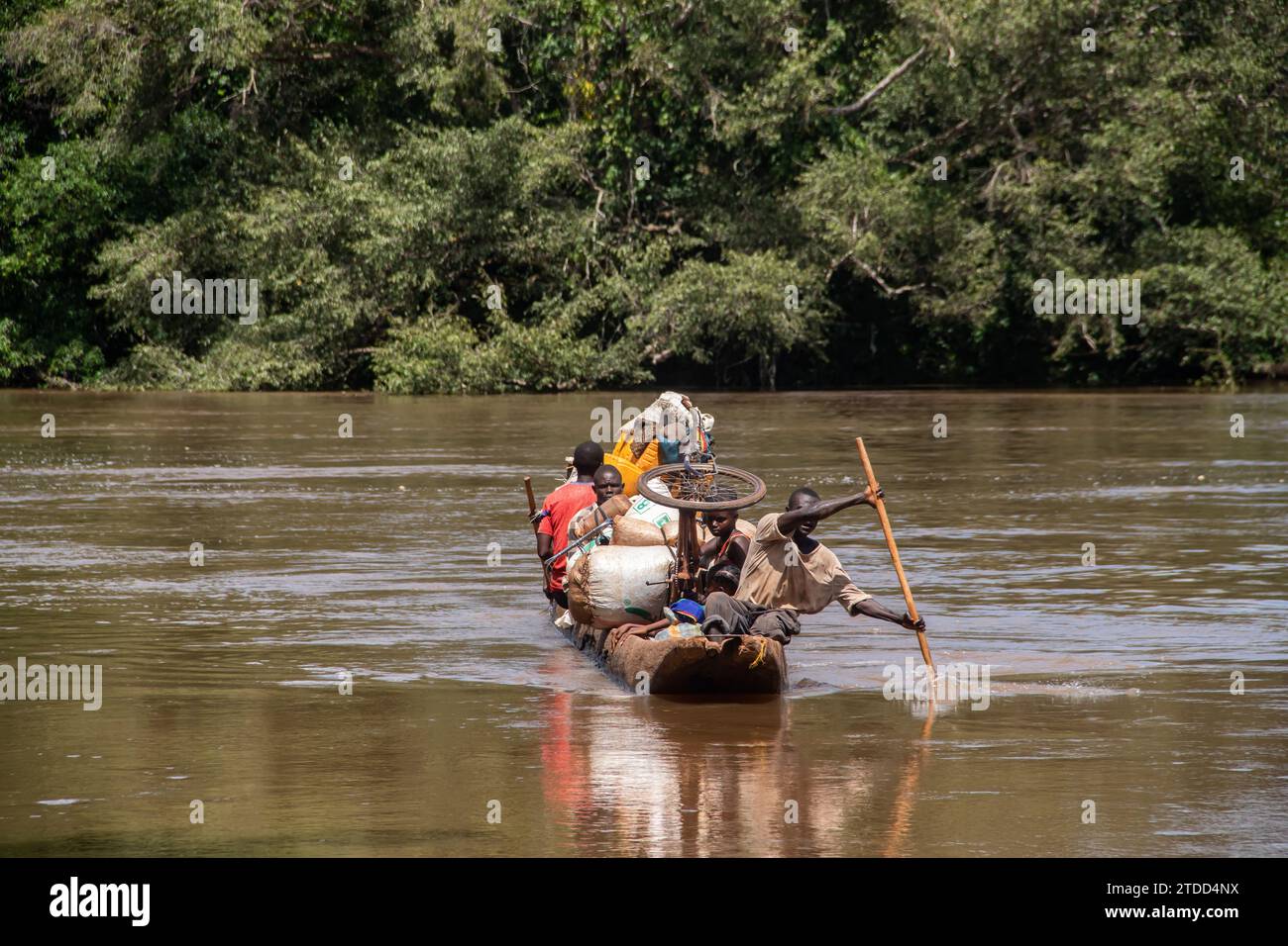 Transport of people across the Mbari river by locally made canoes and ...