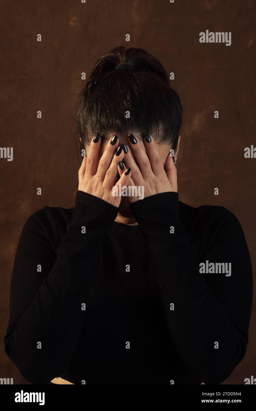 Stressed woman head in hands Stock Photo - Alamy