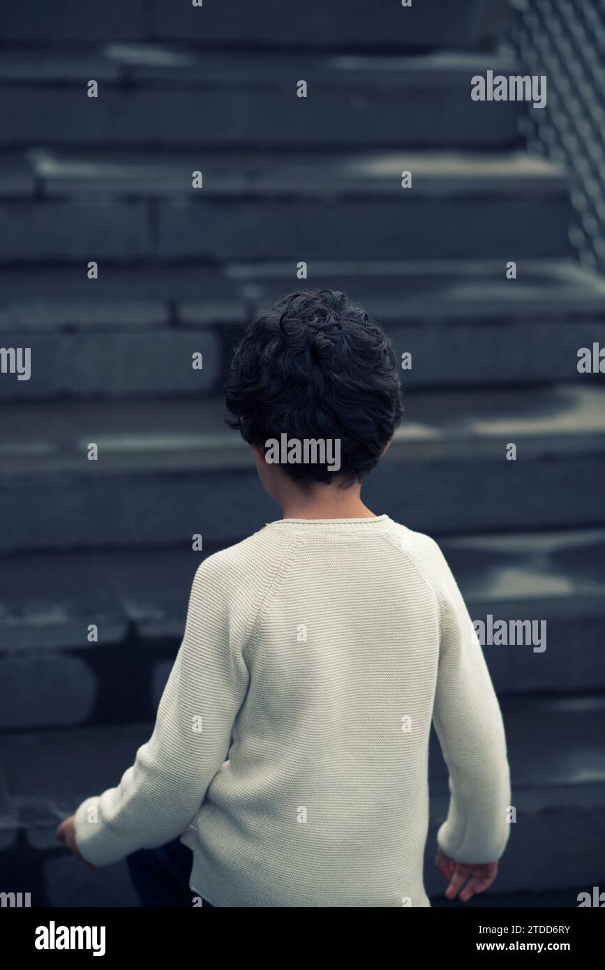 Child back view stairs hi-res stock photography and images - Alamy