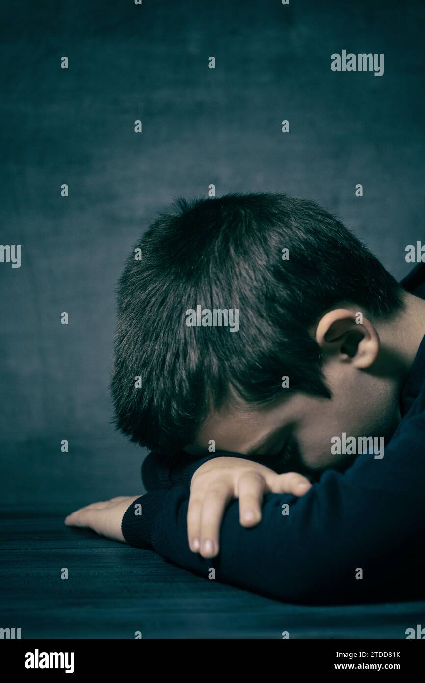 Sad 8 years boy Stock Photo - Alamy