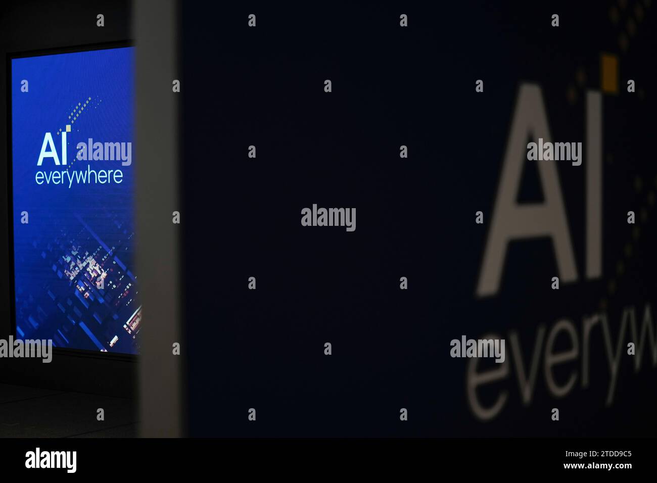 Signs display the name of an Intel event called AI Everywhere in New ...