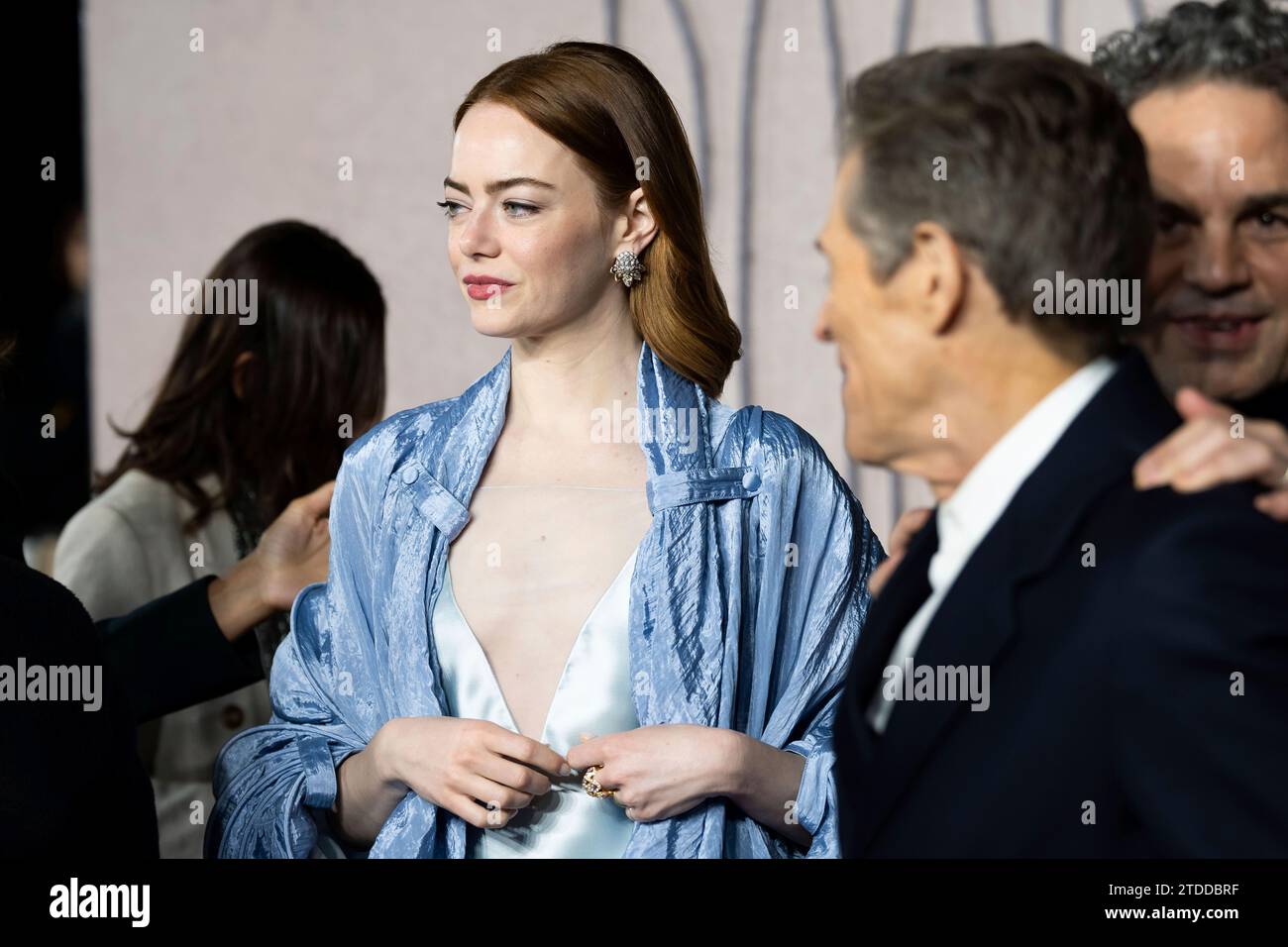 Emma Stone, left, Willem Dafoe and Mark Ruffalo pose for photographers upon arrival at the ...