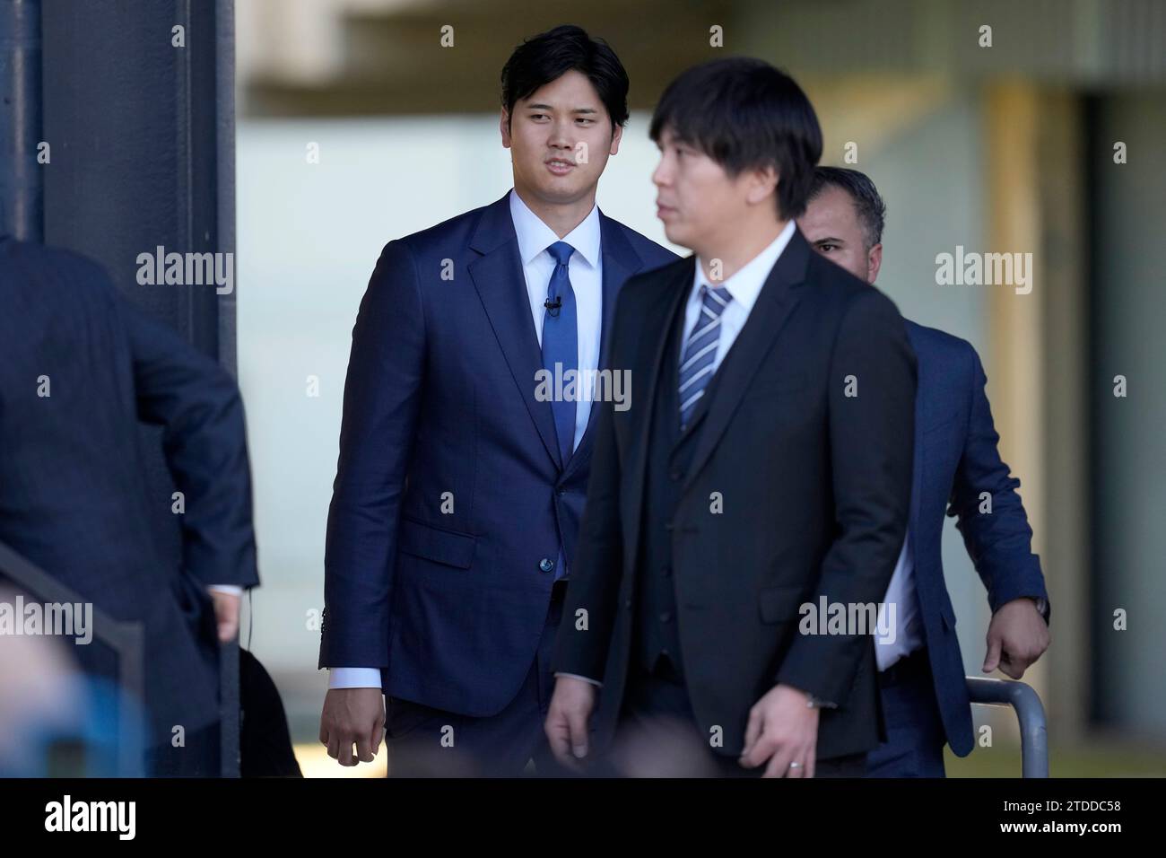 Los Angeles Dodgers' Shohei Ohtani, left, walks onto the stage behind ...